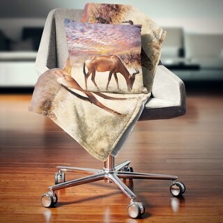Designart 'Antelope in Bush under Dramatic Sky' African Landscape ...