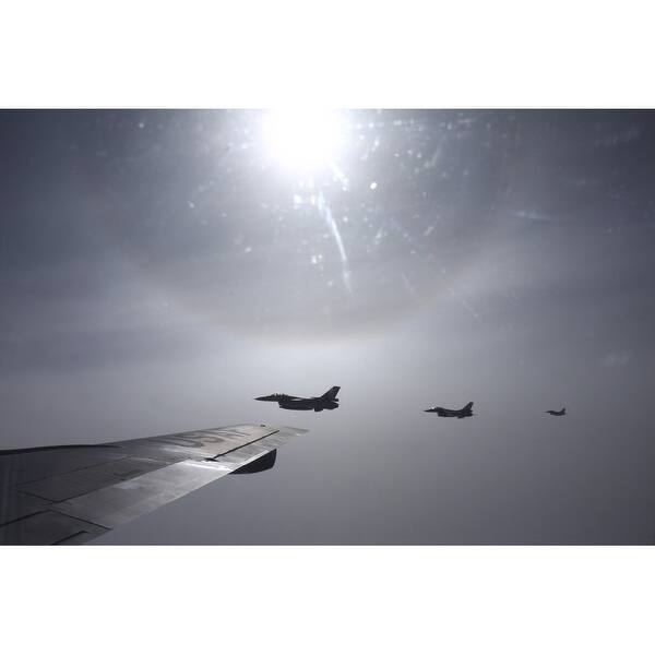 Three Lockheed Martin F16 Fighting Falcon Fighters Over The Wing Of A U ...