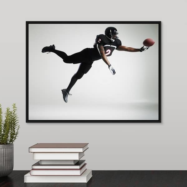 "Football player leaping in mid air to catch ball" Black Float Frame ...