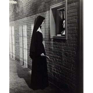 Film still of Audrey Hepburn dressed as a nun talking through a window ...