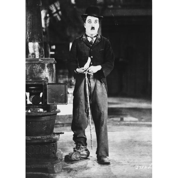 A film still of Charlie Chaplin holding a chain Photo Print - Bed Bath ...