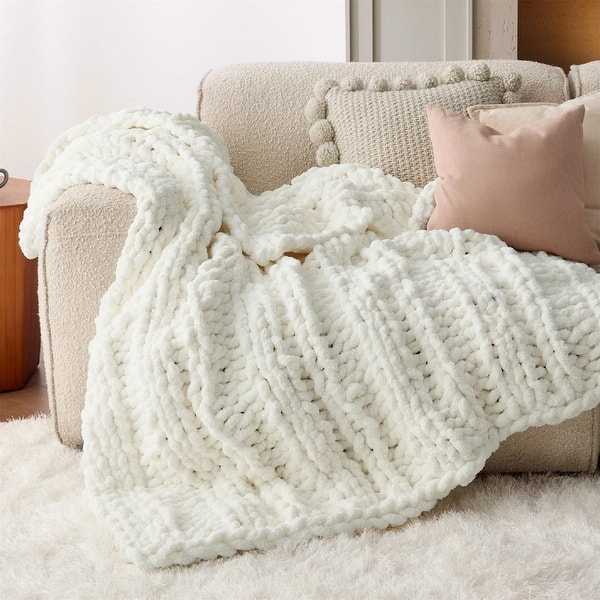 white knitted bed throw
