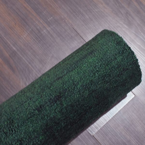 solid dark green area rug