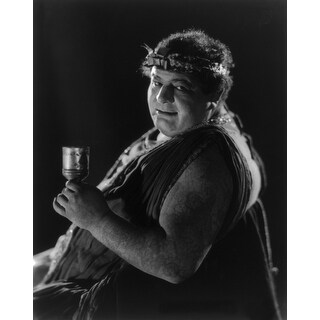 Actor From Mack Sennett Comedy Film In Roman Toga Seated Holding Wine ...