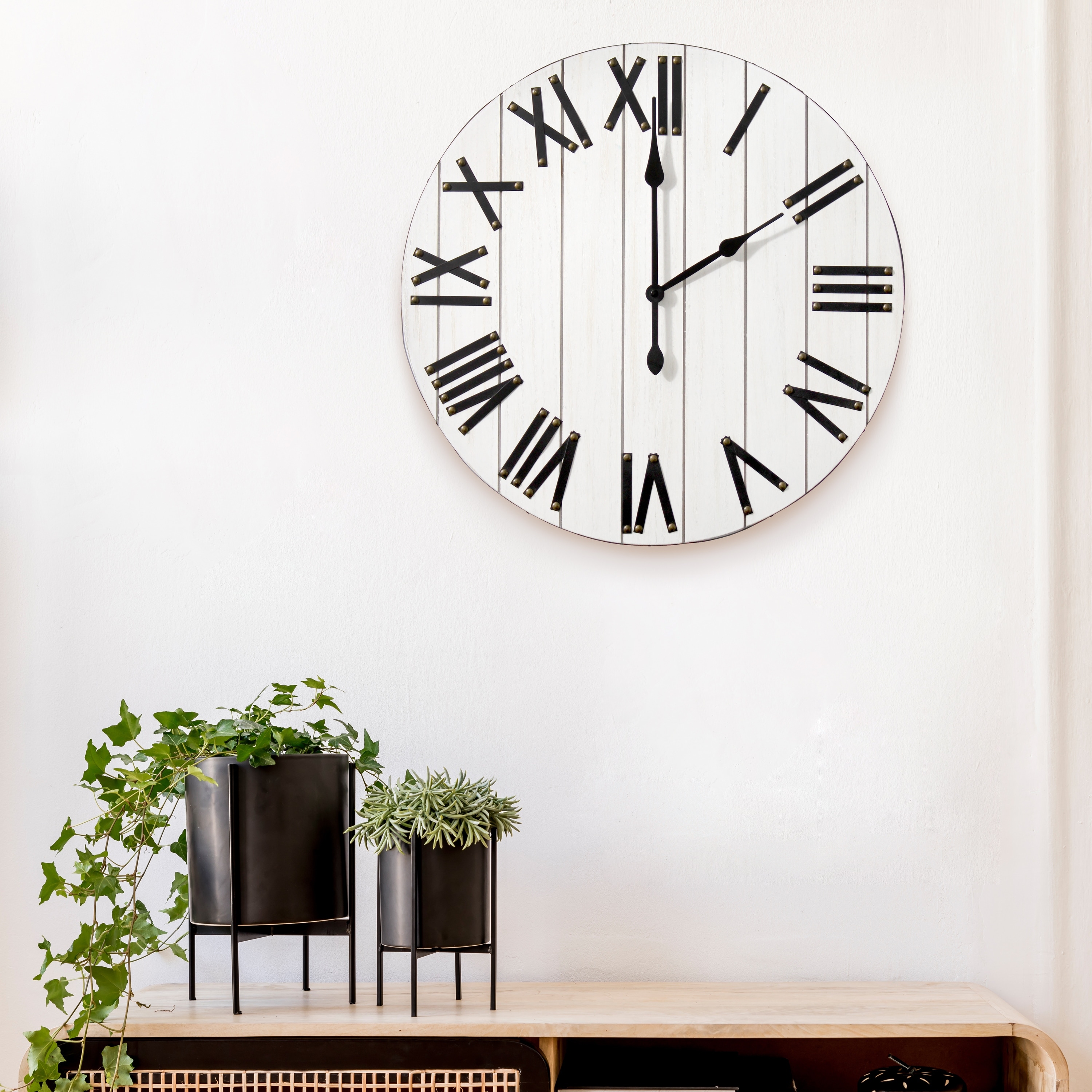 wall clock on white wall