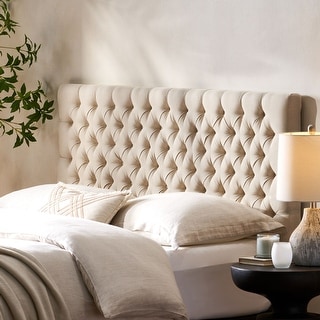 Modern style headboard frame is fully upholstered for a clean and ...