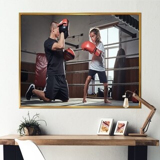 Designart "Young Trainer Training A Little Girl Boxer" Boxing Framed ...