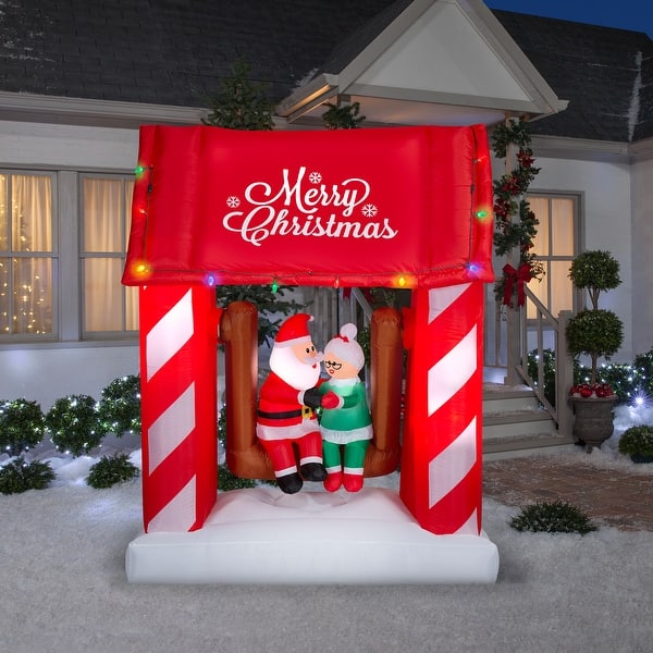 Gemmy Animated Christmas Inflatable Mr. and Mrs. Claus on Swing, 7 ft ...