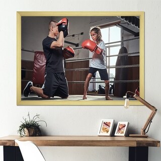 Designart "Young Trainer Training A Little Girl Boxer" Boxing Framed ...