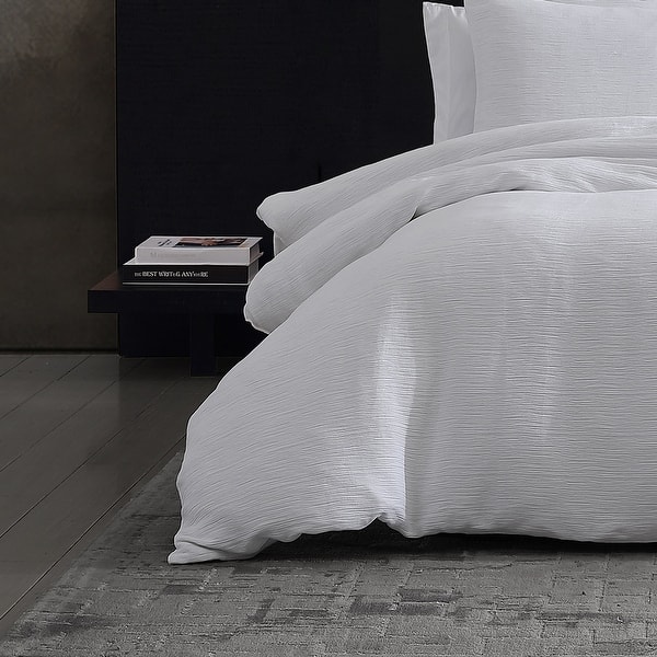 white textured bed sheets
