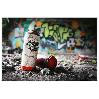 "Piece of evidence - empty paint can in front of graffiti-covered wall ...
