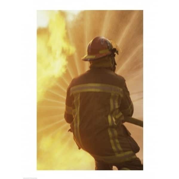 Rear View Of A Firefighter Extinguishing A Fire Poster Print (18 X 24 ...