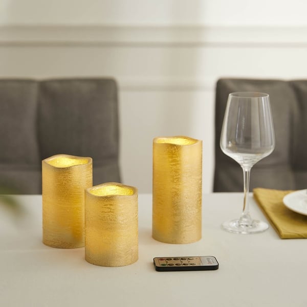 melted gold candlesticks