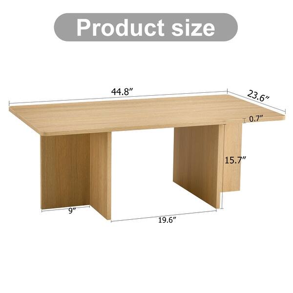 A modern and practical wood colored coffee table.The coffee table is ...