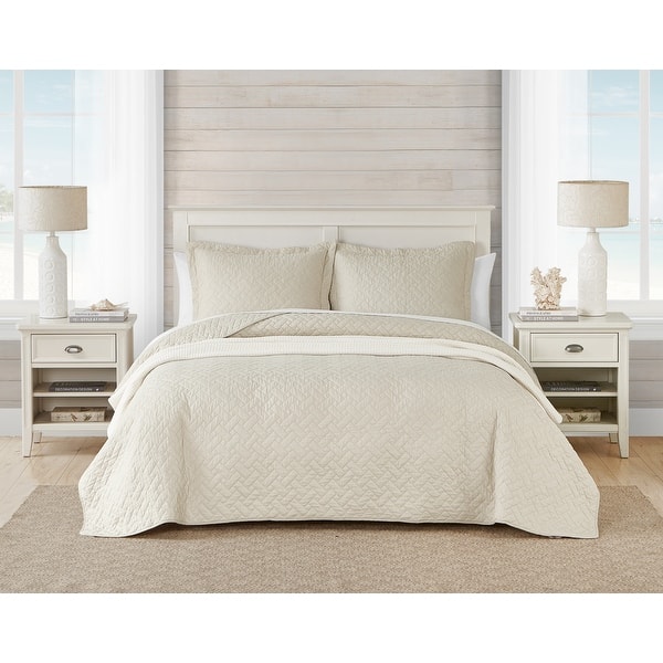 beige textured bed sheets