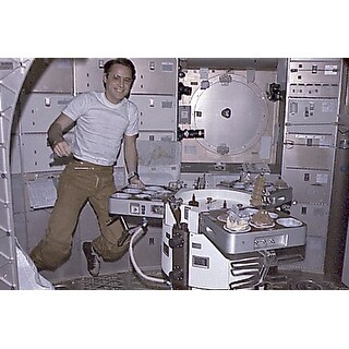 Skylab 4 Astronaut Ed Gibson Preparing His Meal Aboard The Skylab Space ...