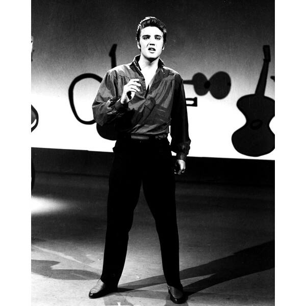 Television still of Elvis Presley performing on The Ed Sullivan Show ...