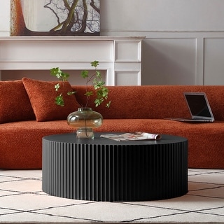 Sleek and Modern Round Coffee Table with Eye-Catching Relief Design ...