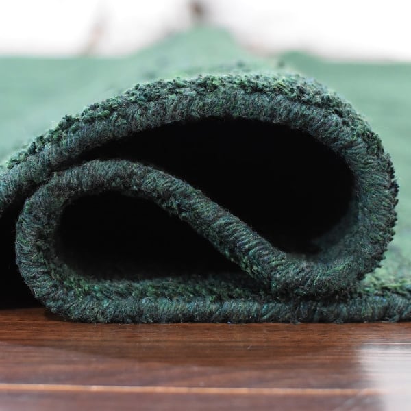 solid dark green area rug