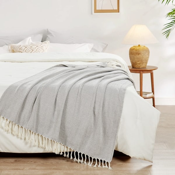 white knitted bed throw