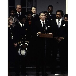 Ronald Reagan speaking on stage with Jesse Jackson Robert Goodman and ...