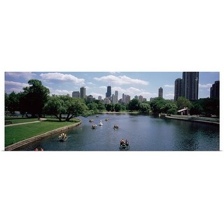 "High angle view of a group of people on a paddle boat in a lake ...