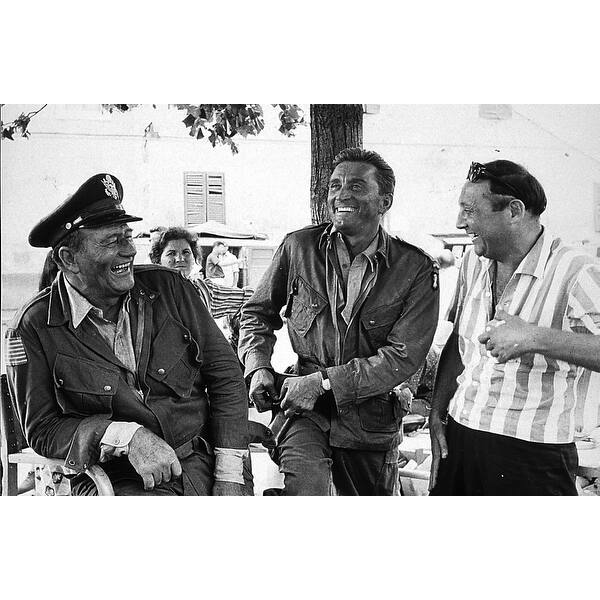 John Wayne Kirk Douglas and Melville Shavelson on the set of Cast a ...
