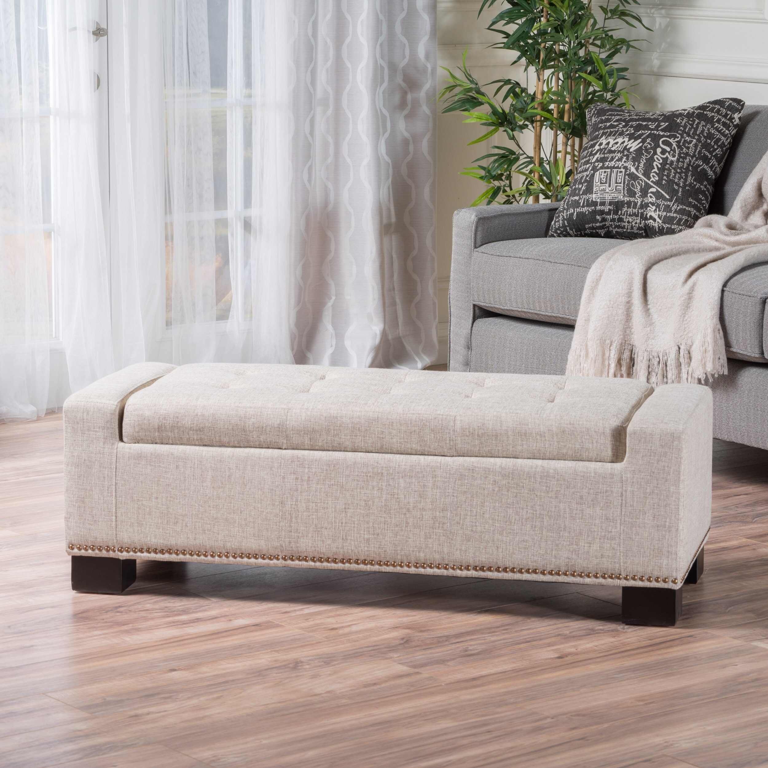 Wheat Colored Storage Ottoman with Studded Trim Tufted Top Hinged Lid Birch Wood Legs Fabric