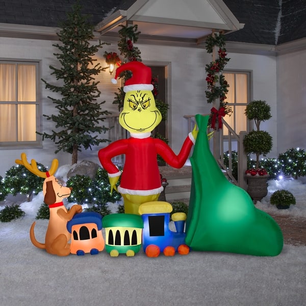 Gemmy Christmas Airblown Inflatable Grinch Putting Train in Santa Sack ...