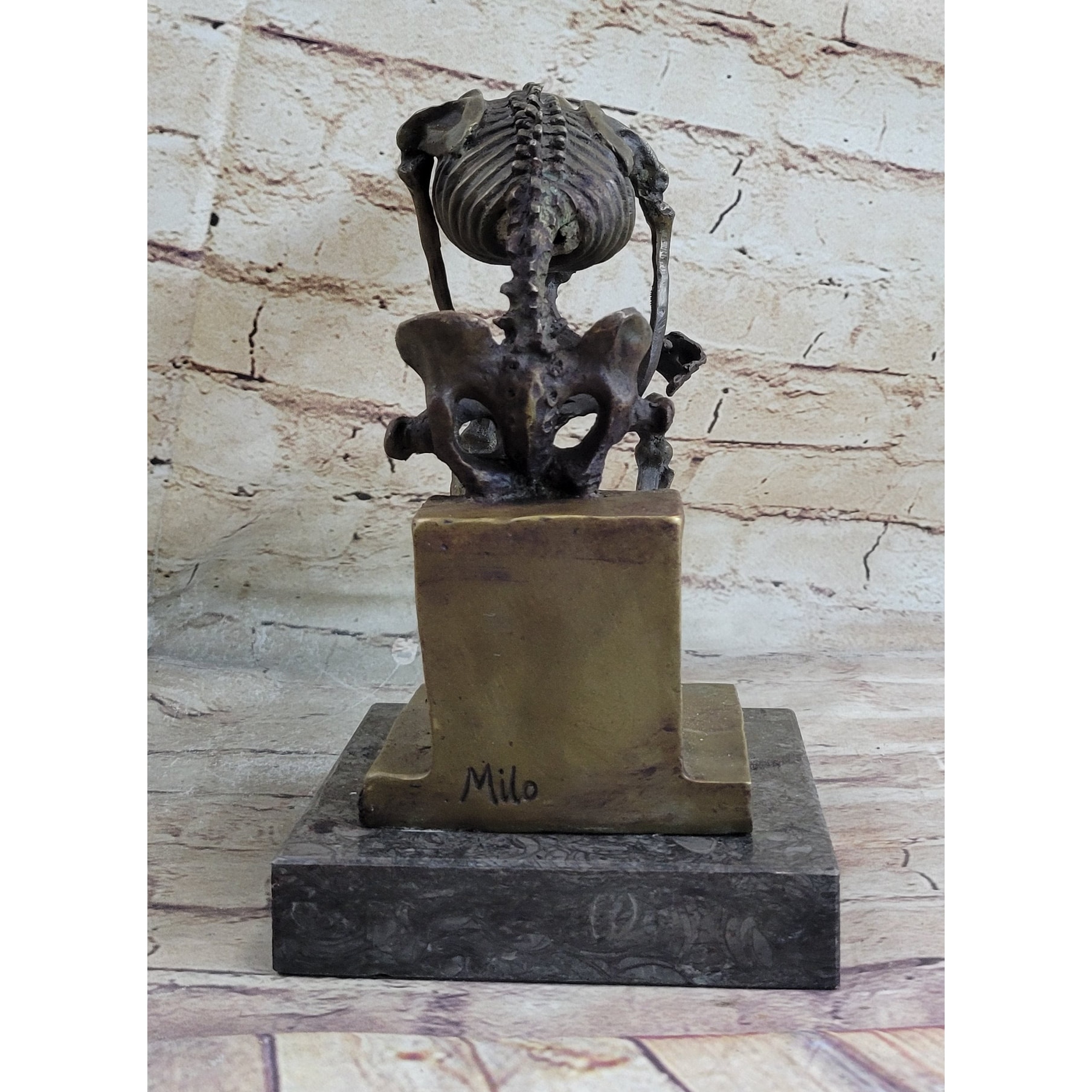 stone thinking man statue