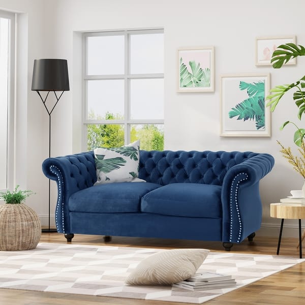 blue button back sofa