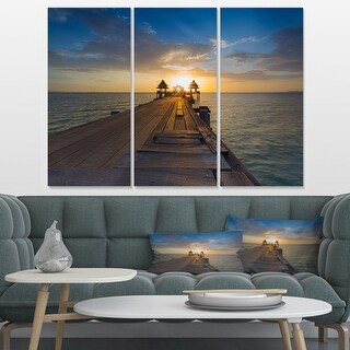 Designart "Huge Wooden Pier into Setting Sun" Pier Seascape Canvas Art ...