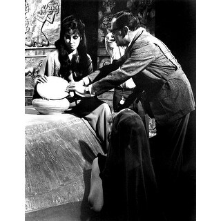 Elizabeth Taylor sitting on a bed on the set of Cleopatra Photo Print ...