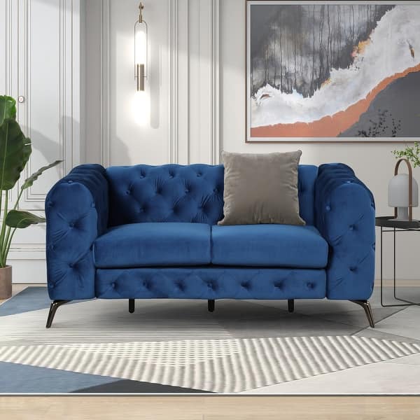 blue button back sofa