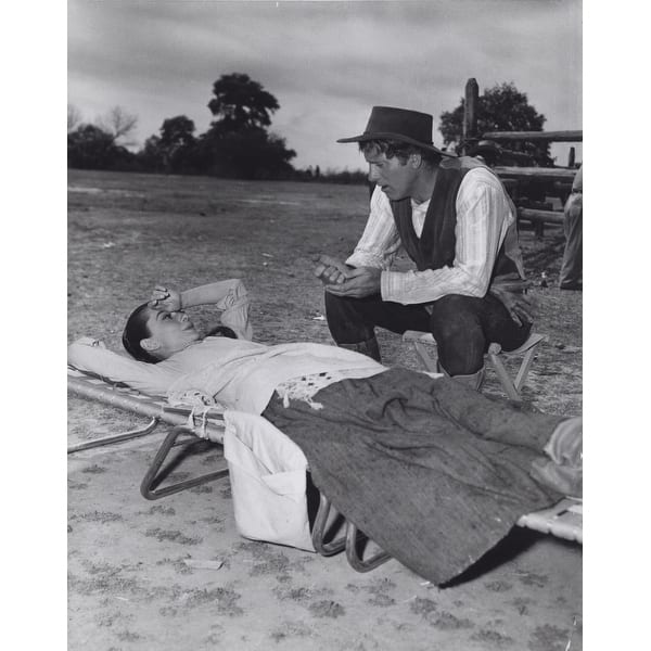 Film Still Of Audrey Hepburn Lying On A Stretcher And Burt Lancaster In