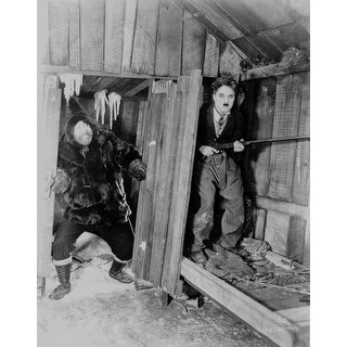 A film still of Charlie Chaplin hiding with a gun Photo Print - Bed ...