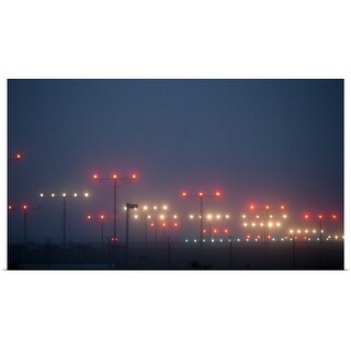 Colorful fogbound landing lights guide airplanes to runway. - Multi ...